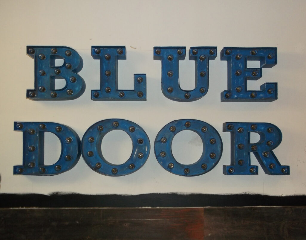 Blue Door - Landmark Sign Group